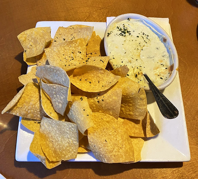 Chip-dipping elevated to an art form. This creamy spinach artichoke dip makes vegetables count as comfort food—a culinary magic trick.
