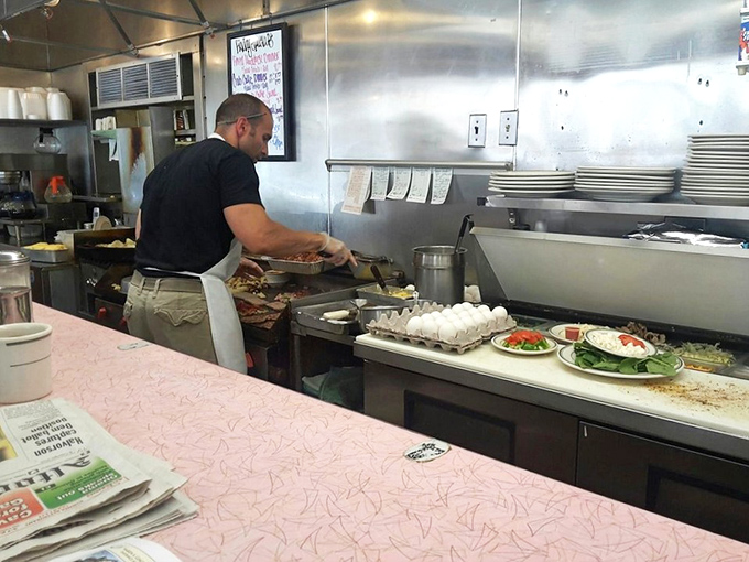 The unsung hero of your breakfast experience, working the grill with the focus and precision of a surgeon, just with more delicious results.