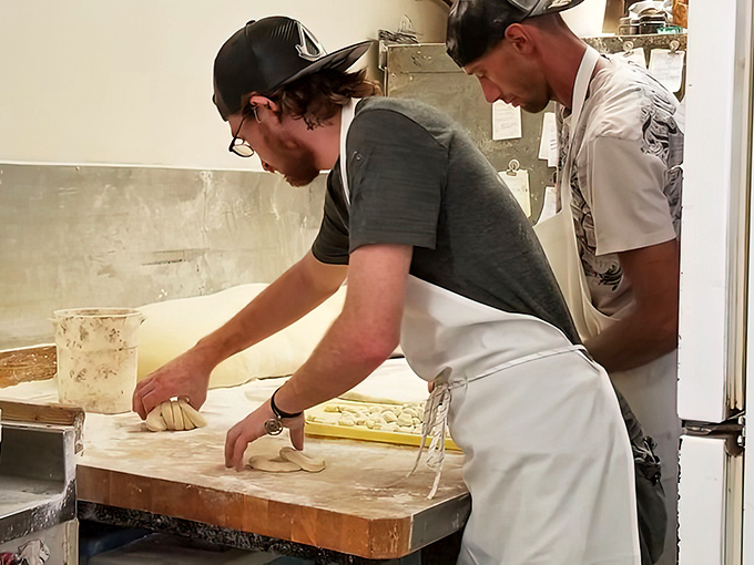 Artisans at work. These bakers aren't just making donuts—they're crafting memories that will linger long after the powdered sugar is gone.