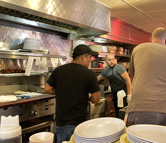 The kitchen crew performs their breakfast ballet with practiced precision, turning ordinary ingredients into extraordinary comfort food.