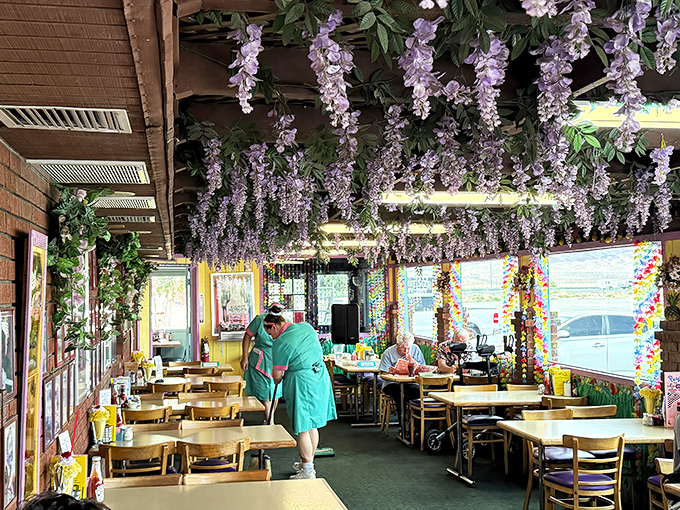 The garden room blooms with artificial wisteria, creating a surreal oasis where desert-weary diners can pretend they're lunching in Capri instead of Yermo.
