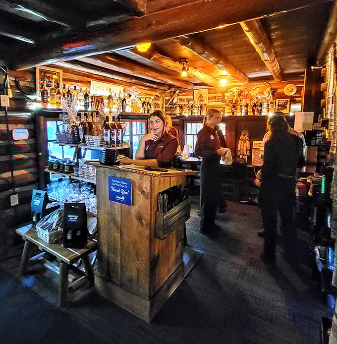 Behind this rustic bar, cocktail magic happens with the efficiency of people who've perfected their craft through thousands of perfect pours.