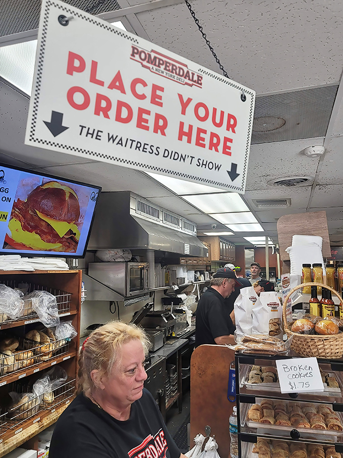 That sign says it all: "The waitress didn't show." Classic deli humor served with a side of New York efficiency.