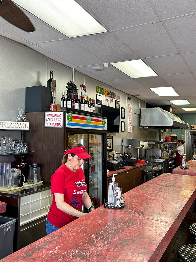 Behind that well-worn counter, staff members orchestrate a symphony of sizzles and aromas that have kept customers returning for decades.