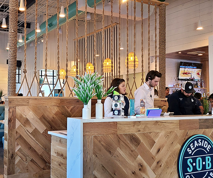 The host stand's herringbone wood pattern and rope dividers set the nautical tone without veering into "ahoy matey" territory.