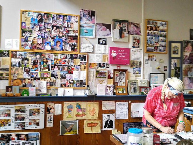 The wall of memories behind the counter isn't decoration&mdash;it's the heart of the place. Years of community connection displayed with pride.