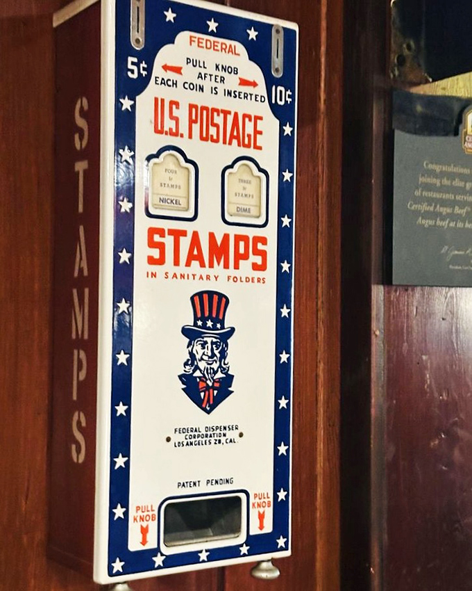 Vintage Americana adorns the walls, including this charming relic from when stamps cost nickels and dimes, not small fortunes.