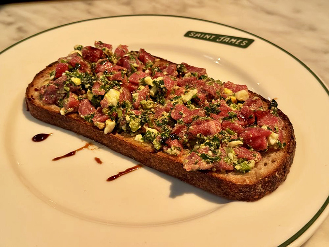 Steak tartare on toast&mdash;where raw sophistication meets primal satisfaction in a dish that says, "Yes, I'm worldly AND hungry."
