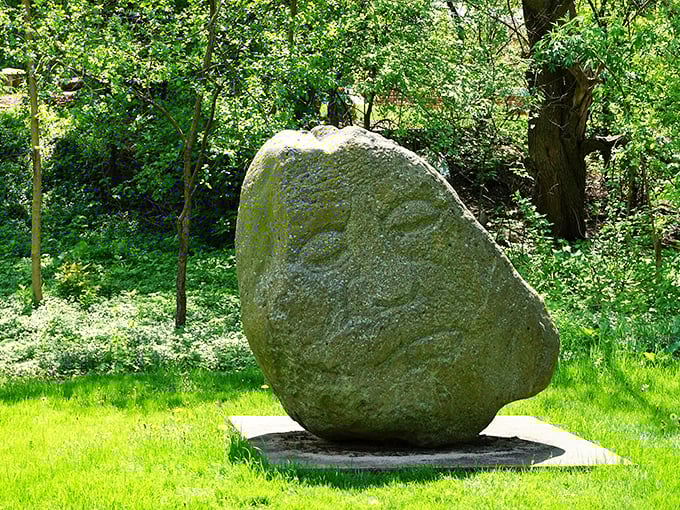 This ancient-looking stone seems to contain a face within its weathered surface, as if centuries of stories are trapped inside.