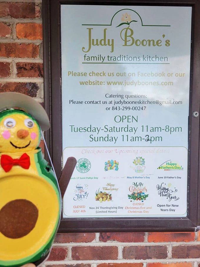 Even the hours sign has personality! That avocado mascot seems to be saying, "Come on in, the eating's fine!"