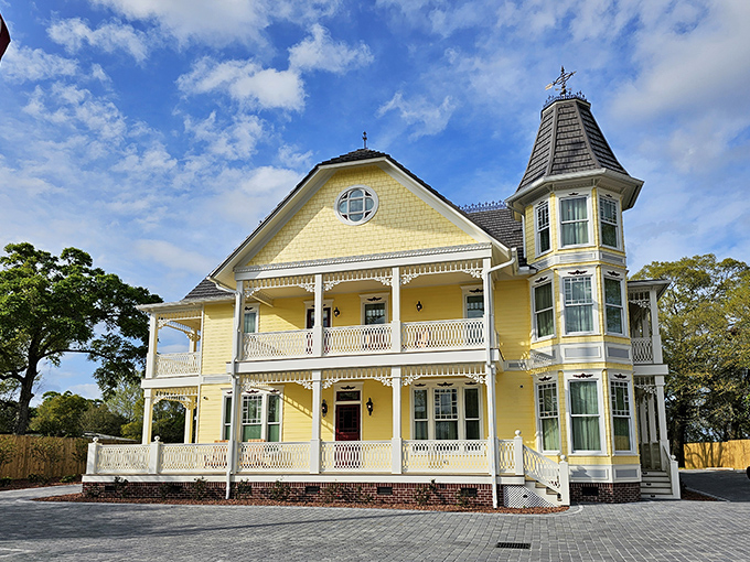 This sunny yellow Victorian beauty looks like it was built by someone who really wanted you to remember where they lived. Mission accomplished.