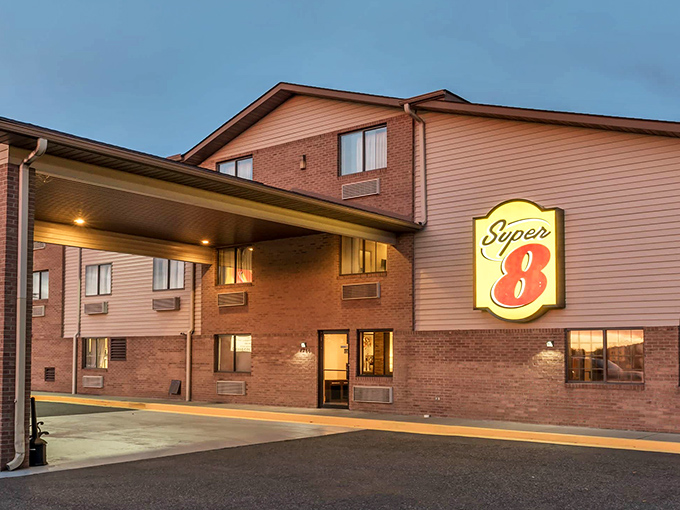 The Super 8 offers no-nonsense accommodations for road-weary travelers, its illuminated sign a beacon of budget-friendly rest after a day of exploration.
