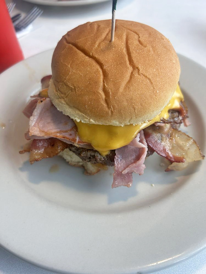 The Hangover Burger doesn't just understand your pain—it actively works to cure it. Egg and bacon: nature's apology for last night.