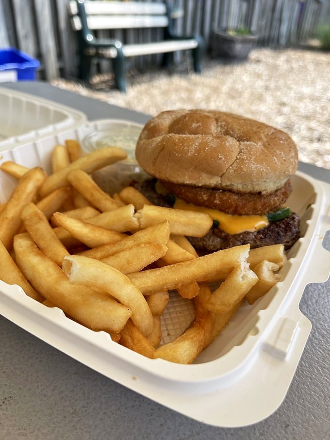 The double-decker masterpiece that requires jaw exercises beforehand. Worth every calorie and napkin.