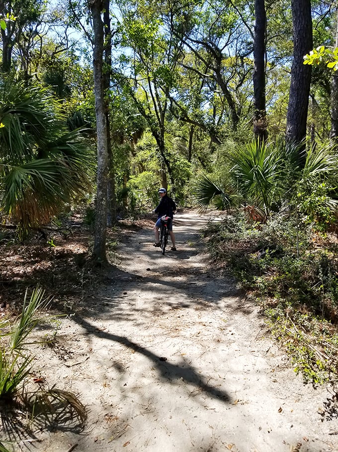 Biking through a maritime forest tunnel where the sunlight dapples through like nature's own disco ball&mdash;no glitter necessary.
