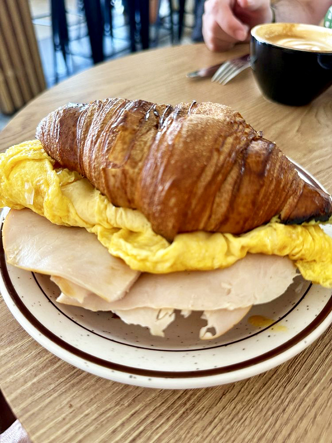This breakfast creation makes other morning sandwiches look like they're not even trying. The croissant-to-filling ratio is mathematical perfection.