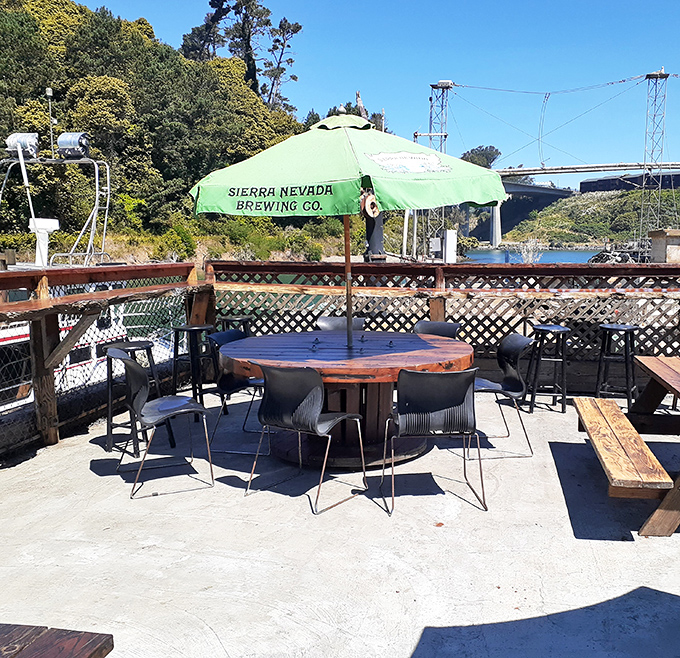 A Sierra Nevada umbrella shades weathered wood tables&mdash;the perfect setting for seafood that was swimming just hours before landing on your plate.