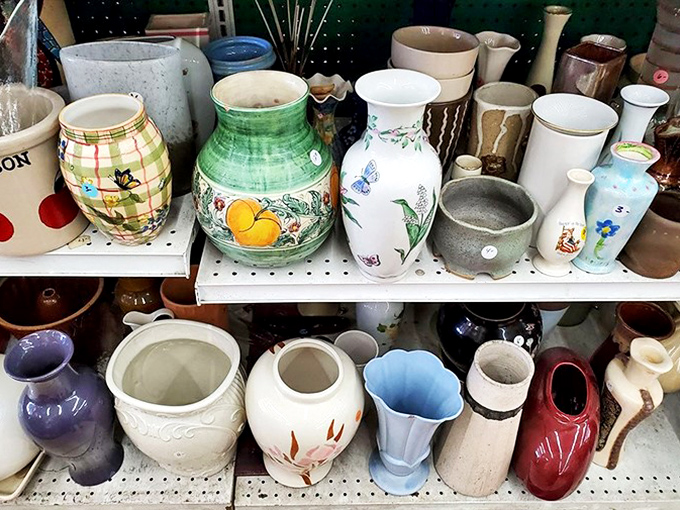 Vases of every era stand in silent formation, waiting for their next floral assignment. From delicate porcelain to chunky '70s ceramics, each has held someone's special occasion blooms.