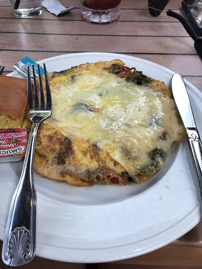 Breakfast meets art in this cheese-crowned creation. Like a morning sunrise wrapped in eggs and possibility.