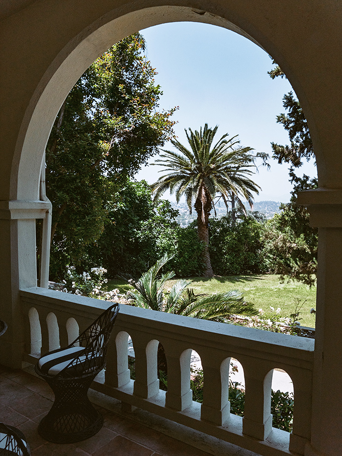 An arched window that frames the California landscape like a living masterpiece. Coffee with this view? Yes, please.