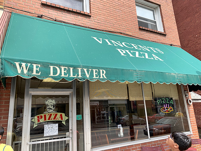 Vincent's Pizza announces its presence with that classic green awning&mdash;the universal signal for "good things happening inside."