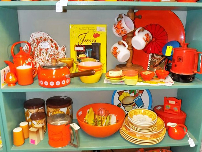The kitchen section is a riot of orange and yellow. These retro cooking tools make avocado-colored refrigerators seem like a subtle design choice.