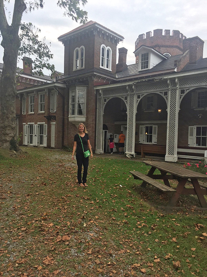 Visitors explore the grounds of Nemacolin Castle, where history comes alive through personal discovery rather than velvet ropes.