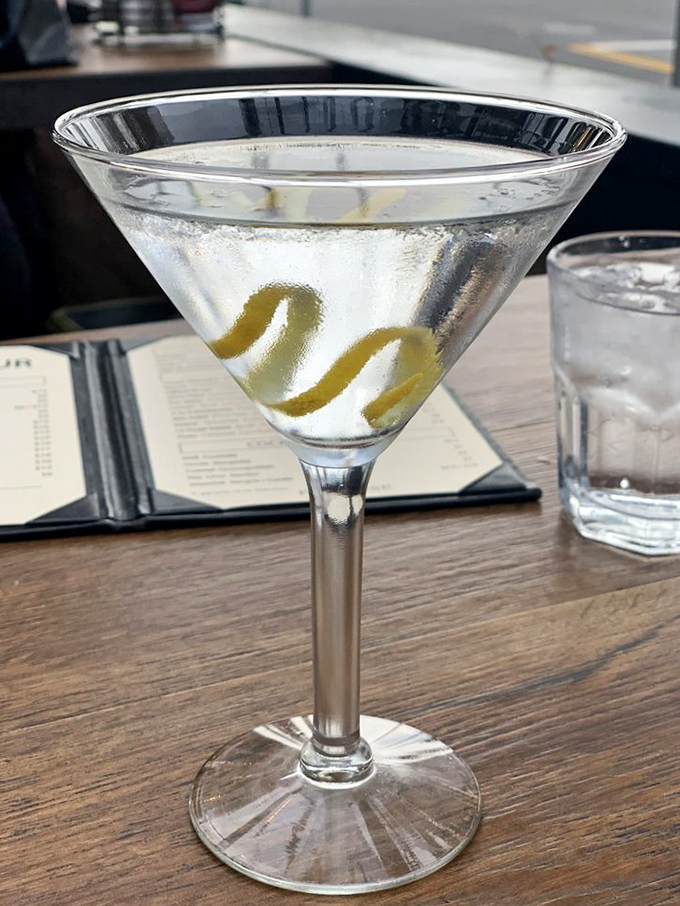 A perfectly crafted martini that proves some classics never go out of style – especially with those elegant olive twists.