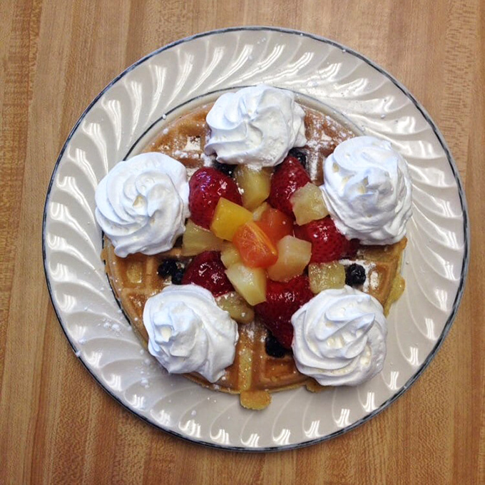 This isn't just a waffle&mdash;it's a dessert disguised as breakfast, where fruit provides the alibi and whipped cream seals the deal.