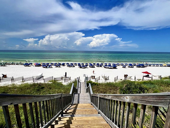 Heaven is down these stairs—the wooden boardwalk leads to sugar-white sands and the emerald-turquoise gradient that makes the Gulf Coast famous.