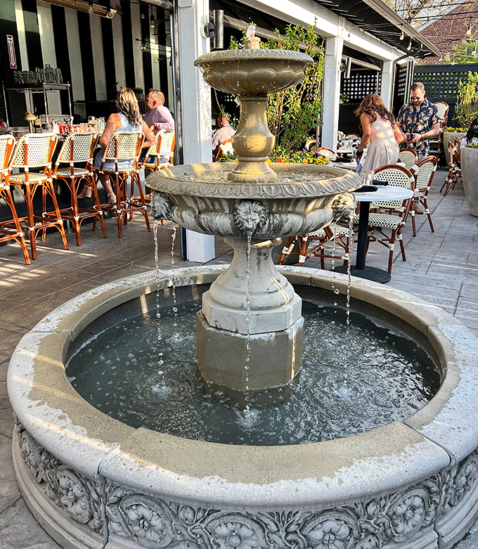 Even the outdoor fountain has old-school charm. Diners enjoy the patio ambiance while water provides nature's soundtrack to their meal.