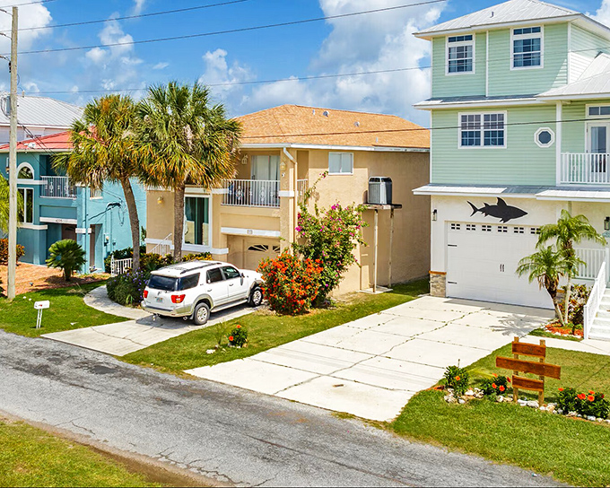 Coastal living in technicolor &ndash; homes painted in hues that would make a box of crayons jealous. 