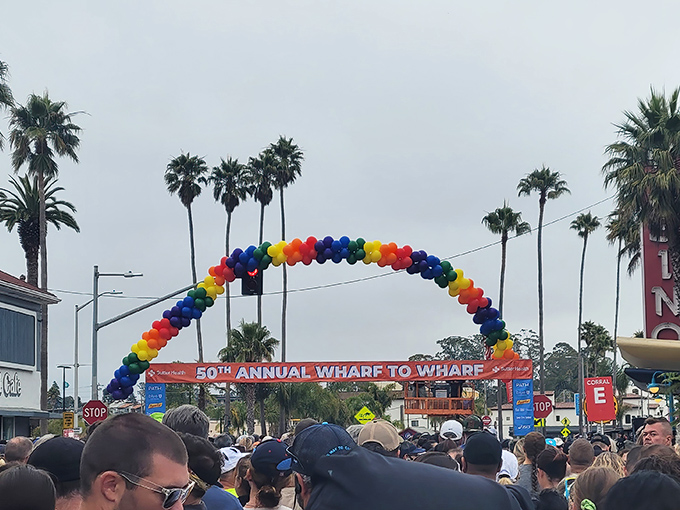 The Wharf to Wharf race transforms Capitola into a rainbow-arched celebration of community spirit and coastal beauty.