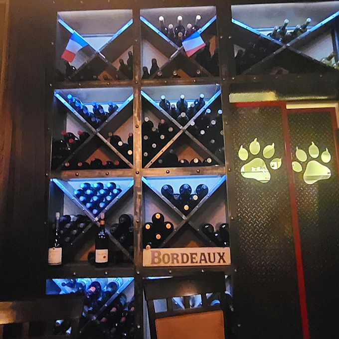 The wine rack glows like a treasure chest of liquid possibilities, with a little French flag reminding you where these bottles' hearts belong.
