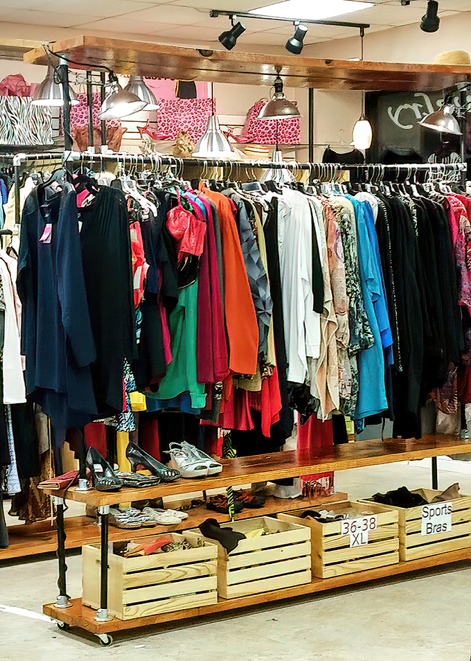 The wooden display rack doubles as retail architecture, showcasing everything from sports bras to shoes with equal dignity.