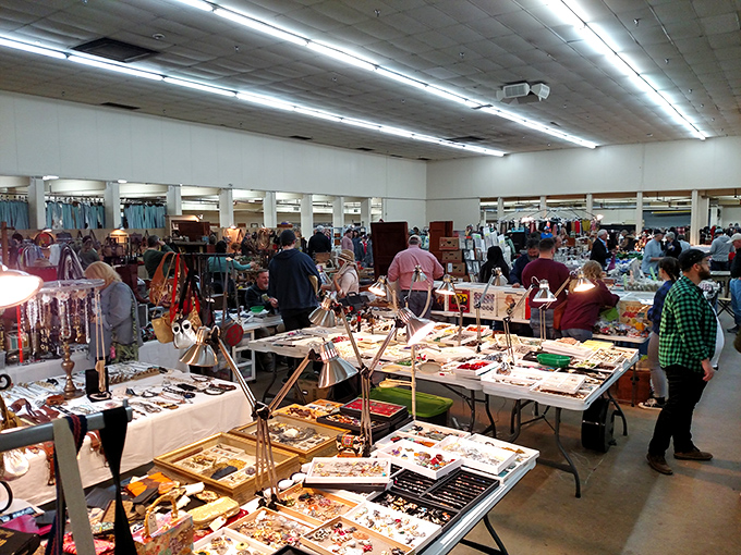 Jewelry displays transform ordinary tables into glittering treasure chests. Vintage brooches and modern beadwork compete for attention in this accessory wonderland.