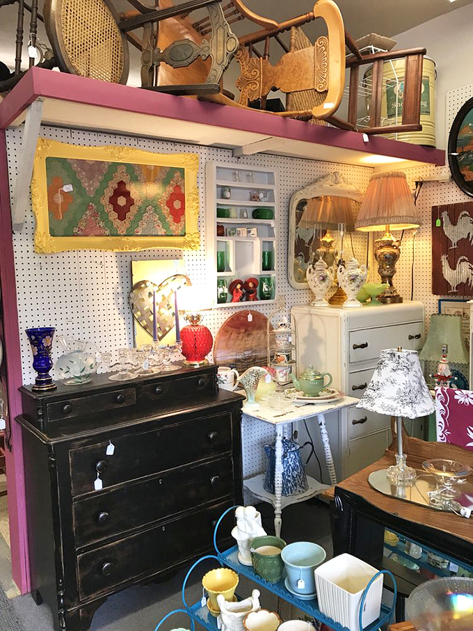 The pegboard backdrop creates the perfect canvas for this colorful display of vintage housewares, where mid-century meets country charm in perfect harmony.