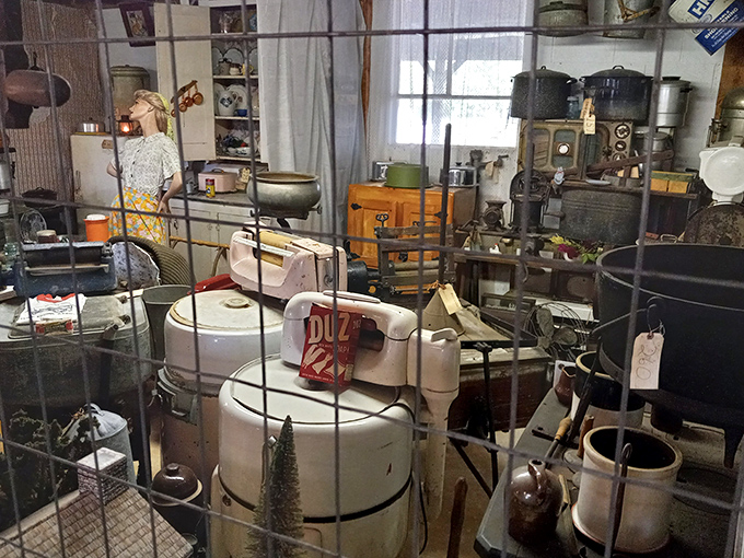 Organized chaos of nostalgia. Every shelf and surface in this vendor's space holds potential treasures for those willing to dig.