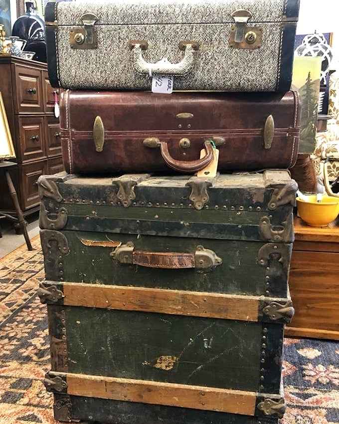 Stacked vintage luggage that traveled the world before rolling suitcases were invented. These beauties have seen more of America than most Americans.