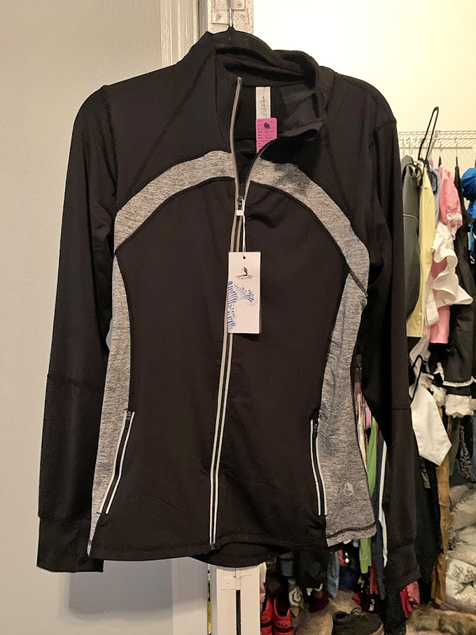 Still sporting its original tags, this athletic jacket proves the thrift store golden rule: patience rewards hunters with brand-new treasures at used-item prices.