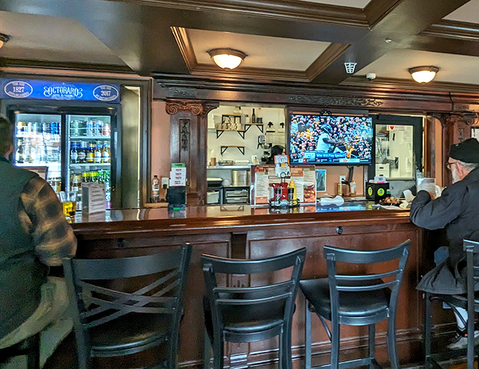 Behind this polished bar, skilled hands craft drinks with the kind of care that turns a simple order into hospitality.