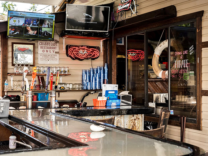 The kind of bar where everybody might not know your name yet, but they'll remember your drink. Neon crabs signal you've found the right spot.