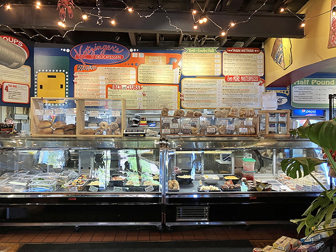 The deli counter gleams with possibility, each glass case a window into a world where calories don't count and sandwiches are stacked sky-high.