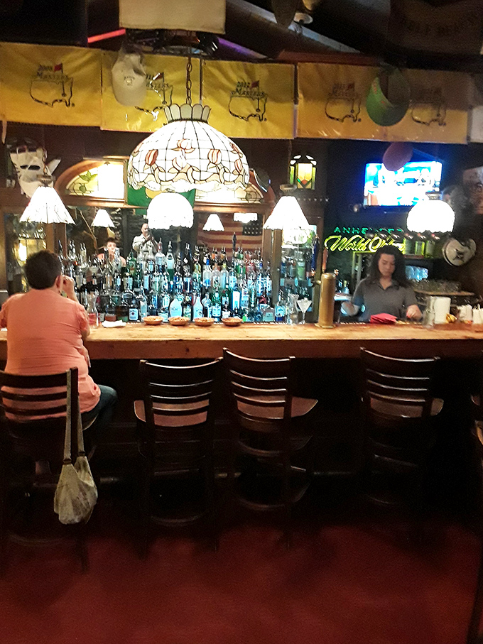 A bar that says, "Pull up a seat, friend&mdash;we've been expecting you," with enough bottles to solve or create life's problems.