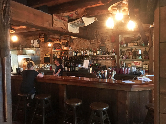 The bar at The Farmstead&mdash;where local brews flow and stories grow taller with each perfectly poured pint.