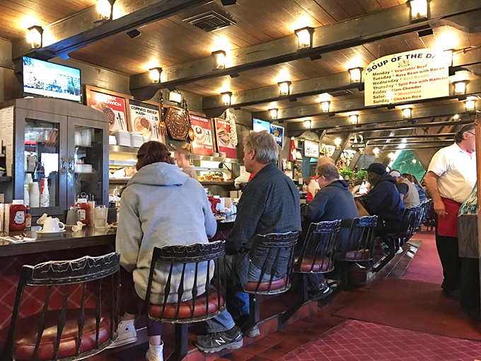 The counter seating&mdash;where solo diners become regulars and servers remember your order before you sit down. Pure diner magic in action.