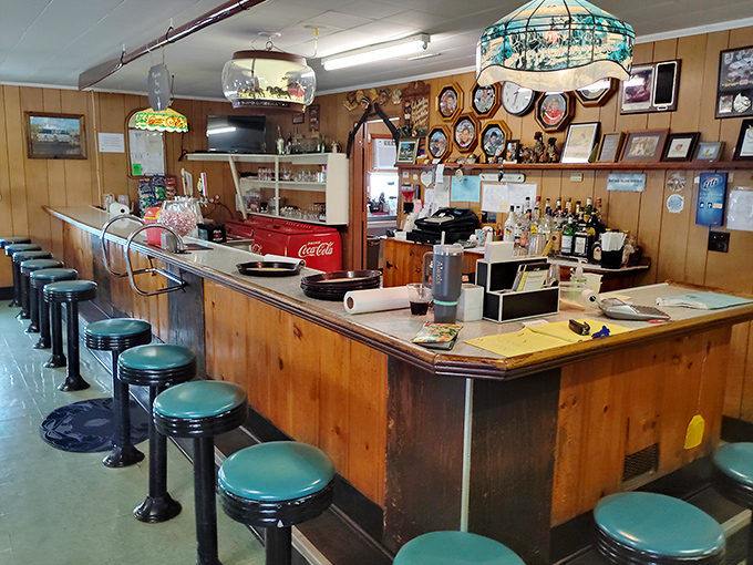 The classic tavern bar setup where cold drinks and warm conversations have been flowing for decades of satisfied customers.