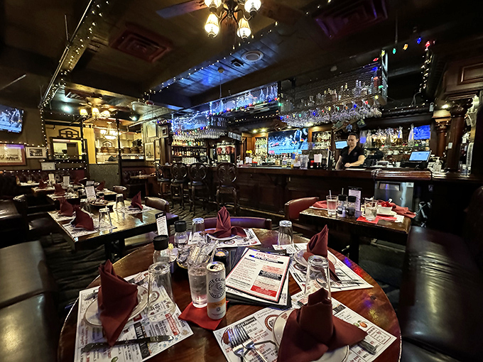 The bar beckons with promises of expertly crafted cocktails and the kind of service that makes regulars out of strangers.