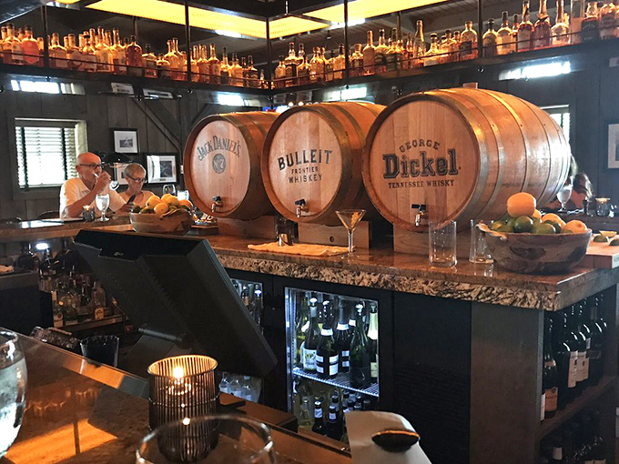The bar showcases whiskey barrels that aren't just decoration&mdash;they're a promise of the bourbon selection that awaits the discerning drinker.