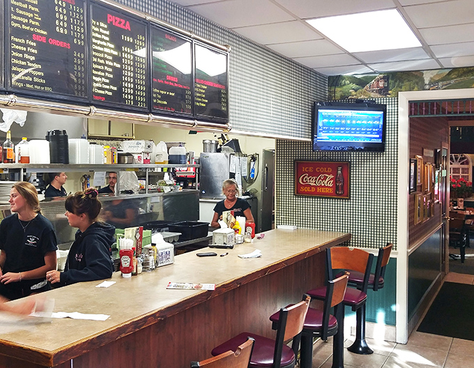 The counter service area buzzes with efficiency, where orders are called and culinary dreams are assembled with practiced precision.